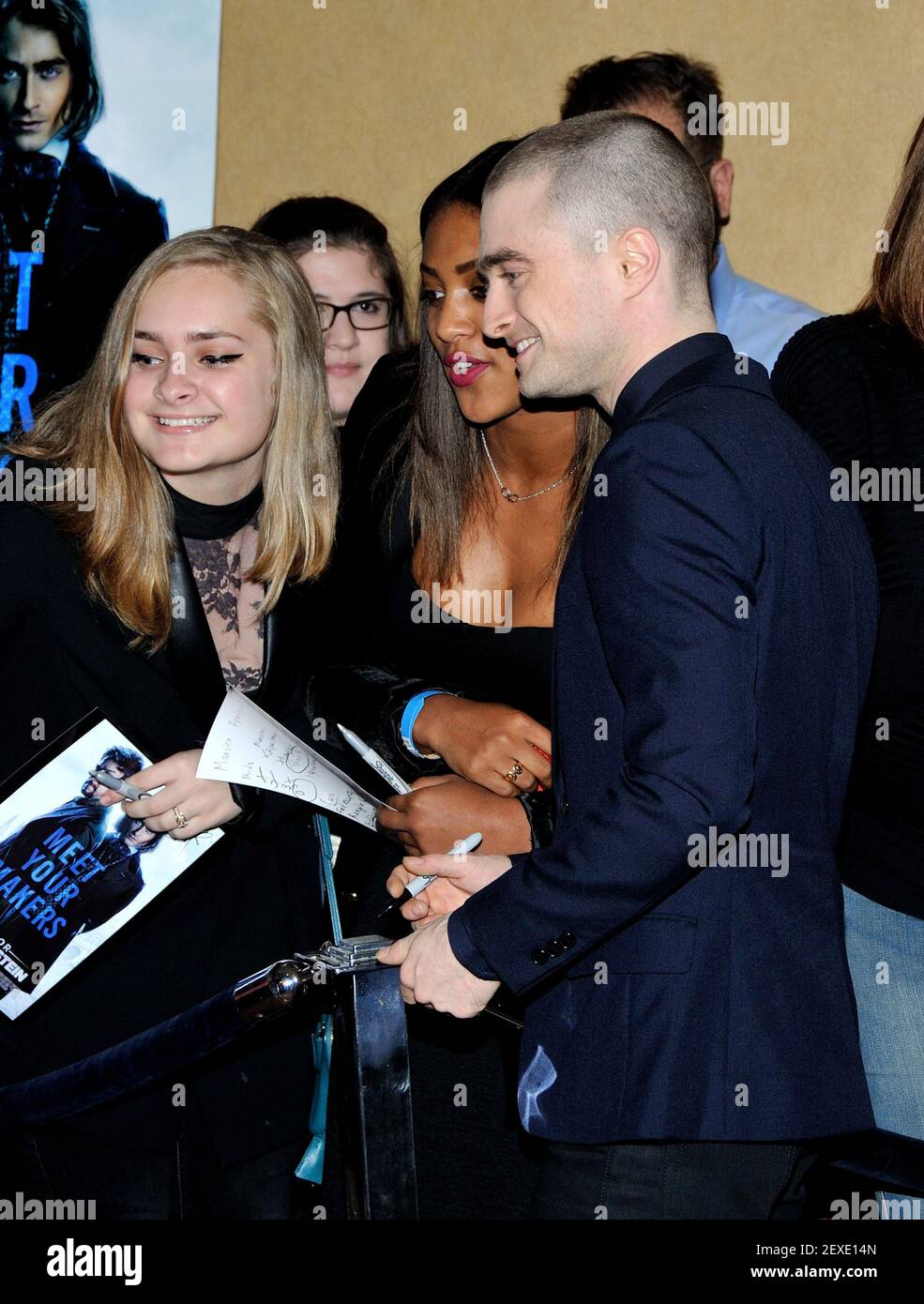 Actor Daniel Radcliffe takes photos with fans at the "Victor ...