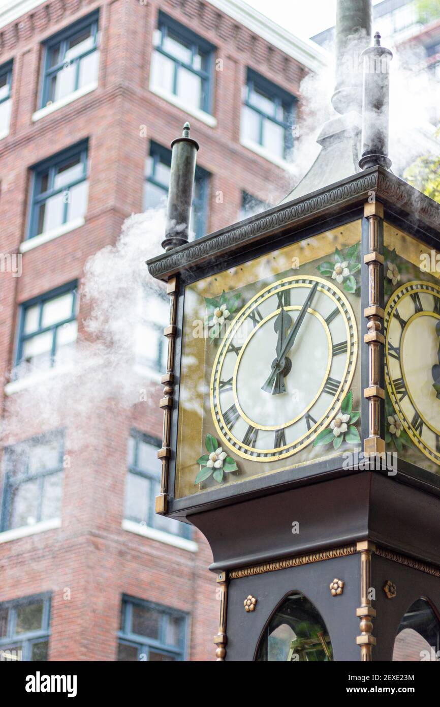 A vertical shot of a vintage outdoor clock Stock Photo - Alamy