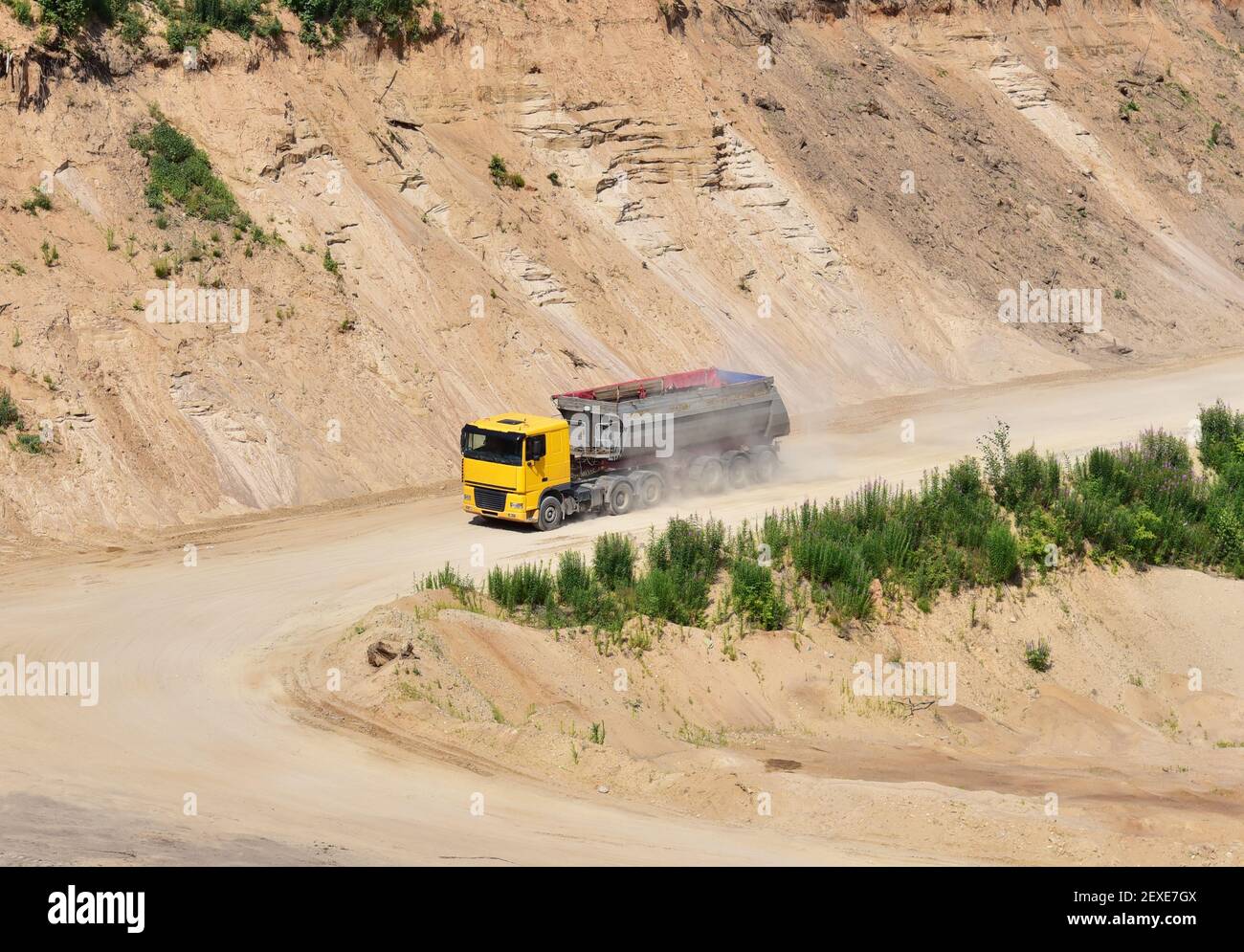 Truck with tipper semi trailer transported sand from the open pit. Dump ...