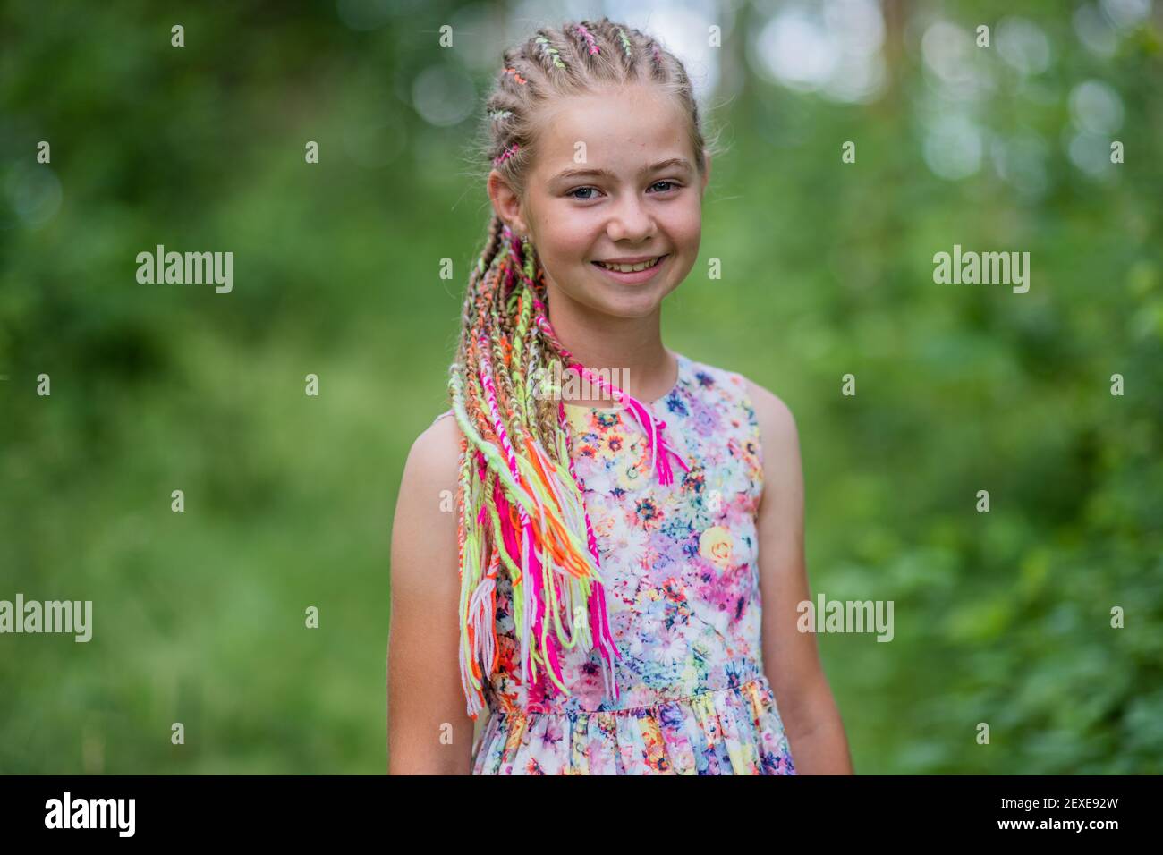 Teenage girl with multi-colored dreadlocks in the forest Stock Photo ...