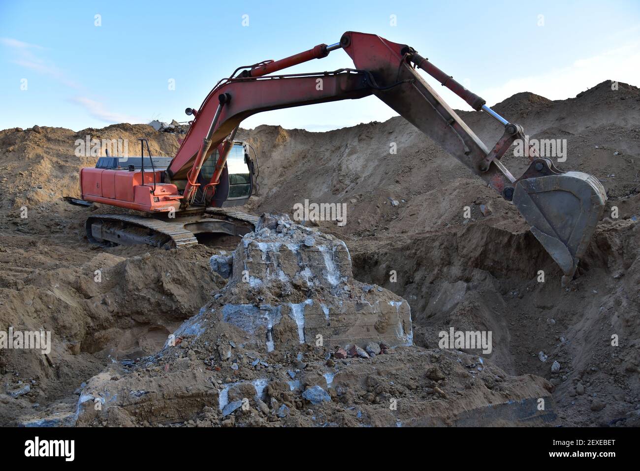 Excavator on demolition the old building. Backhoe the destruction of ...