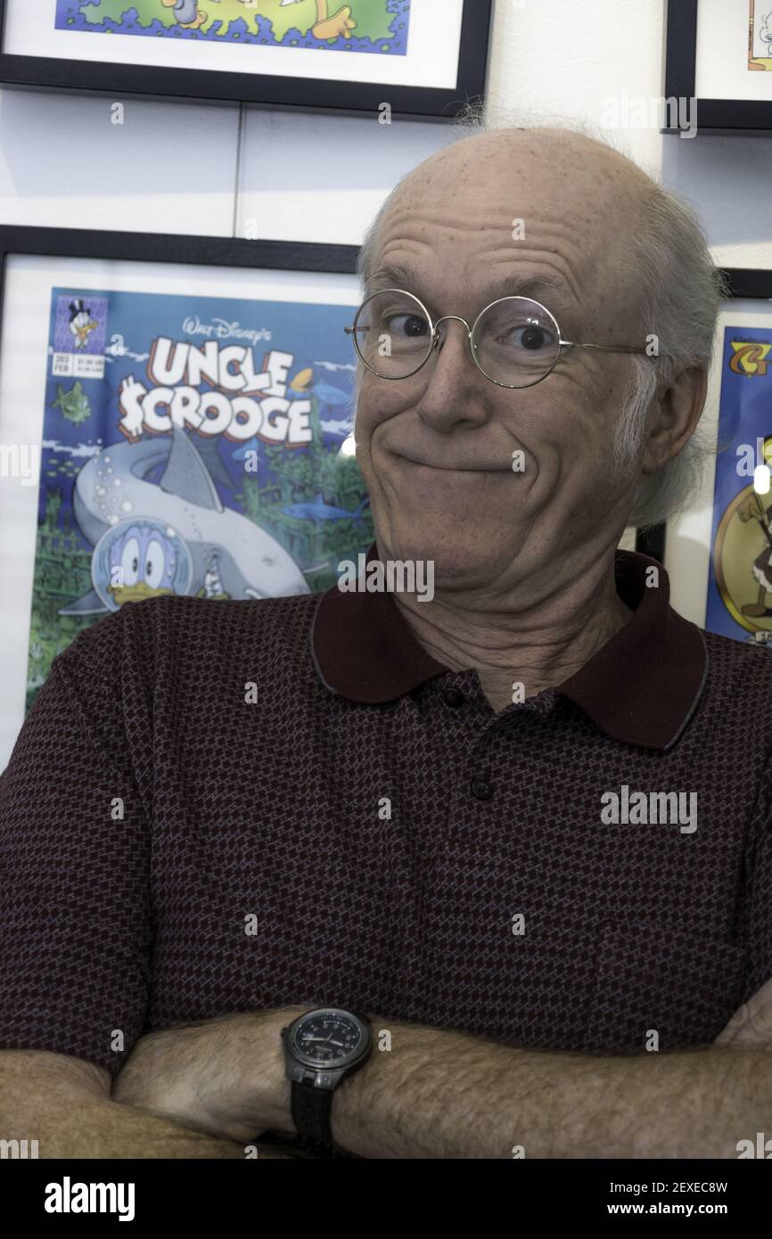 Comic artist Don Rosa smiling in front of the exhibition. Keno Don Hugo ...