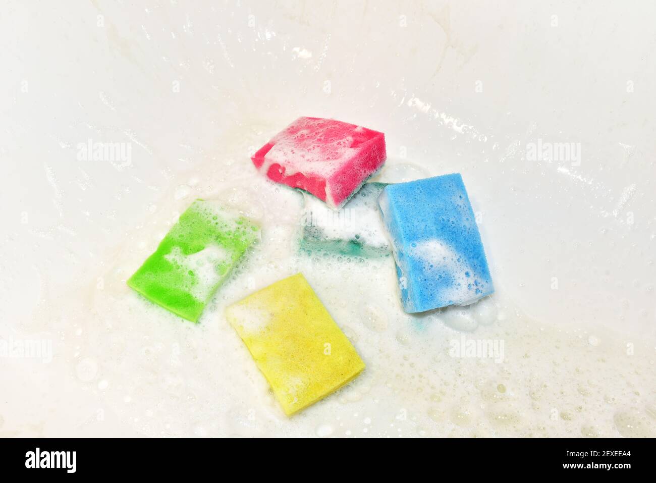 Sponge with detergent and foam while washing. Cleaning Kitchen ...
