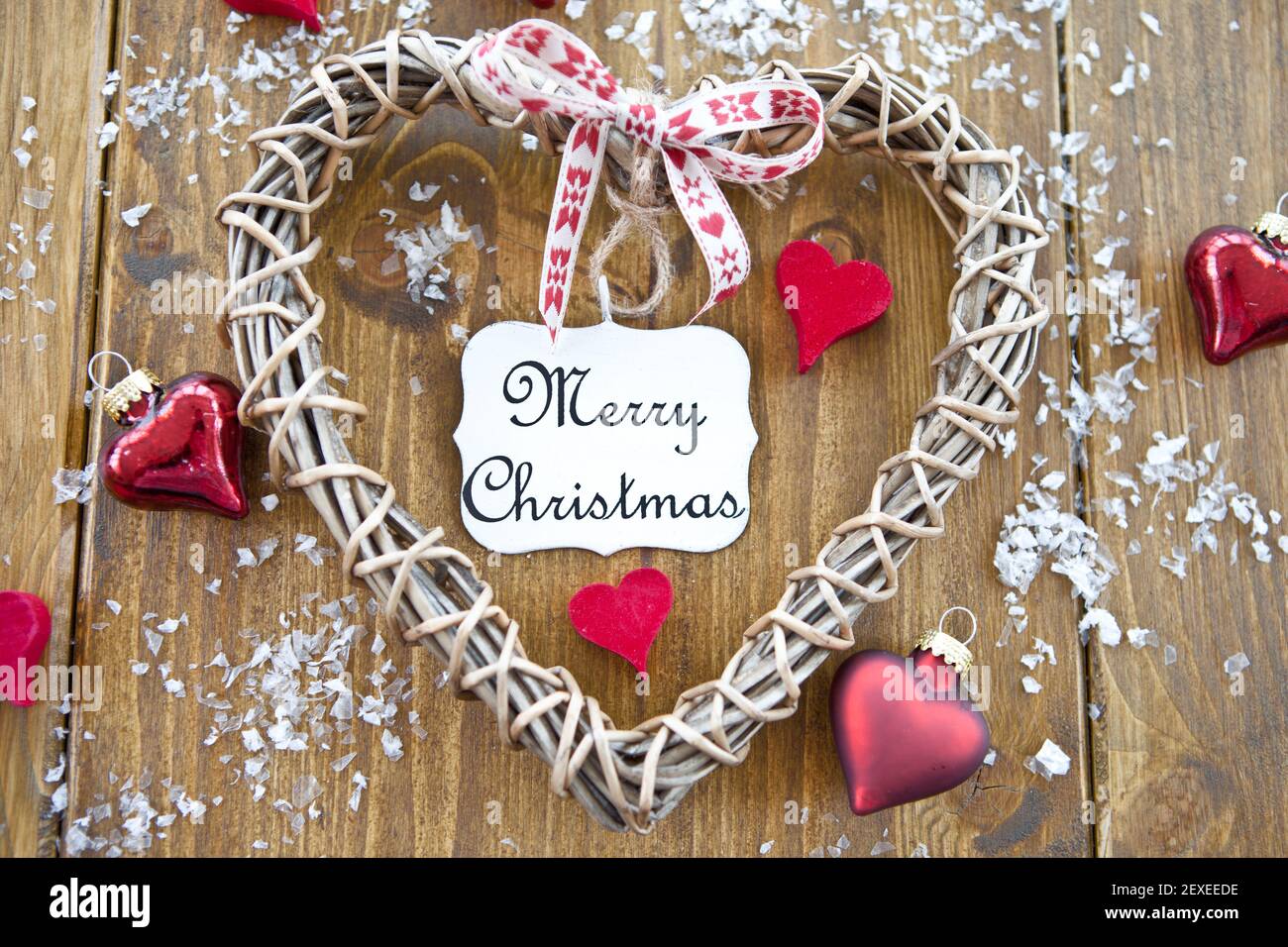 Christmas greetings in heart wreath Stock Photo - Alamy