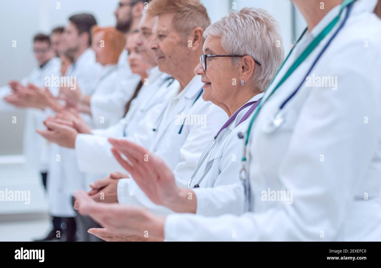 large group of medical practitioners applauding together Stock Photo ...