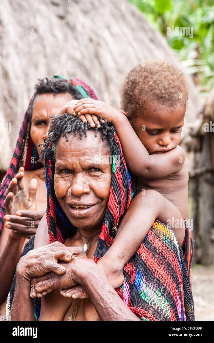 Wamena, Indonesia - January 9, 2010: People of the Dani tribe standing ...