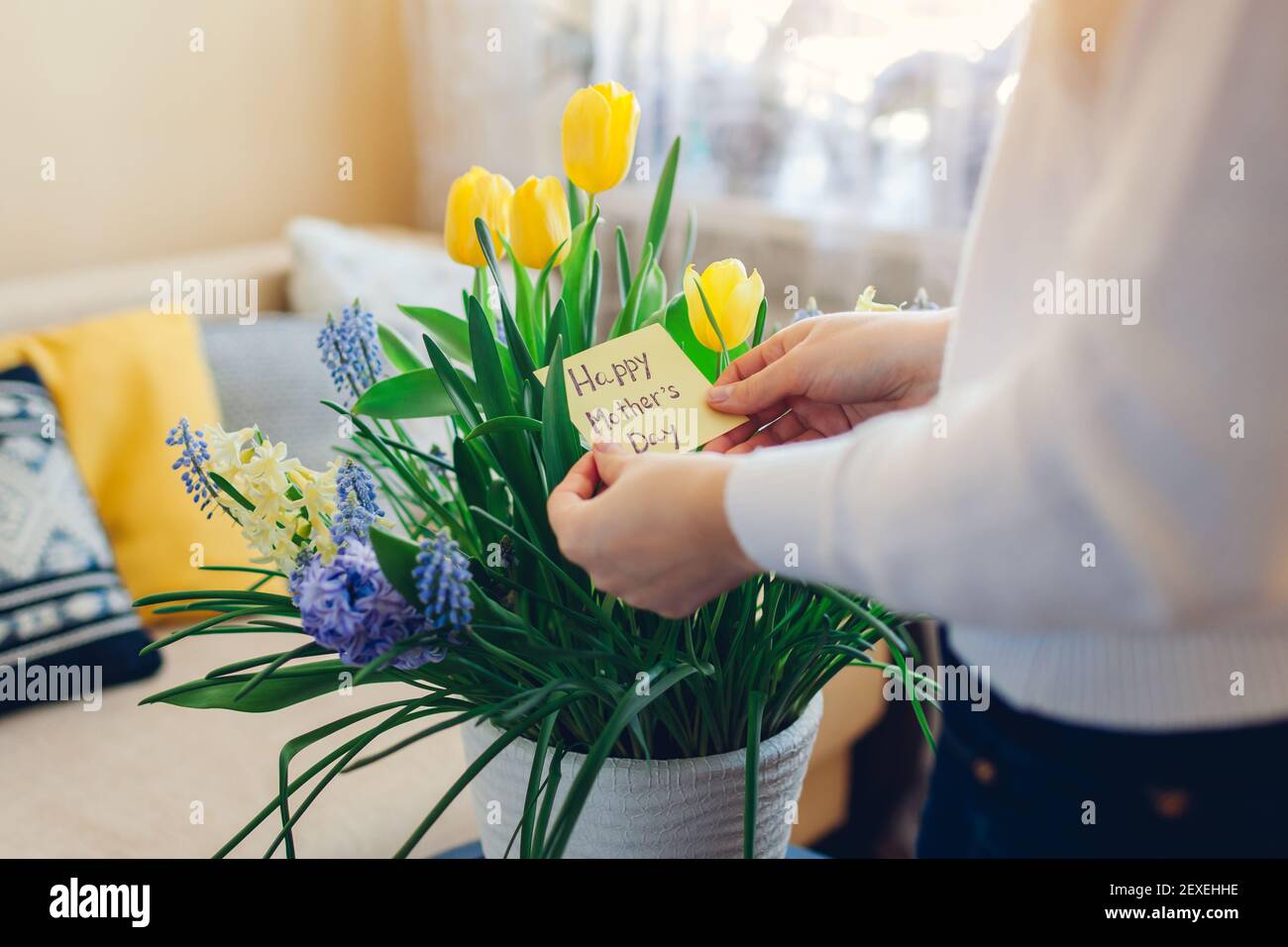 Happy Mother's day. Woman holds greeting card with blooming spring ...