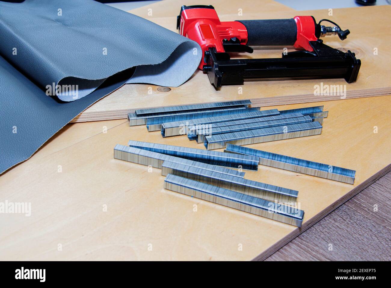 concept of furniture production and repair. Stapler and staples ...