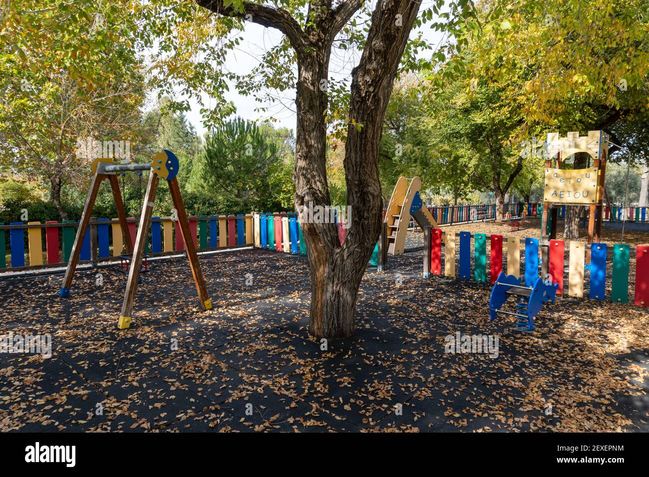 Stock photo of empty playground with fallen autumn leaves on the floor ...