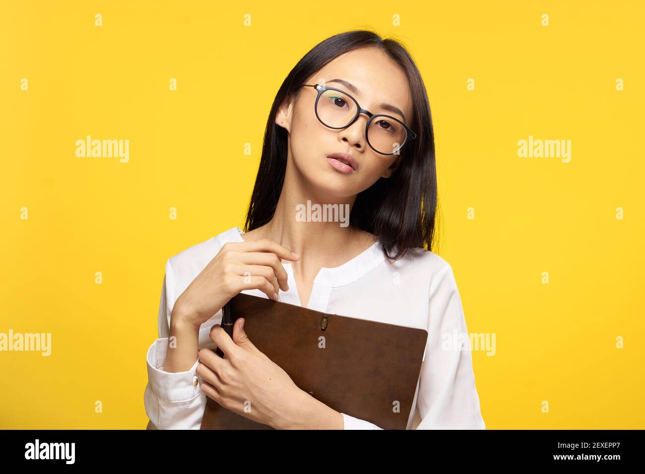 elegant woman with notepad in hands official office yellow isolated ...