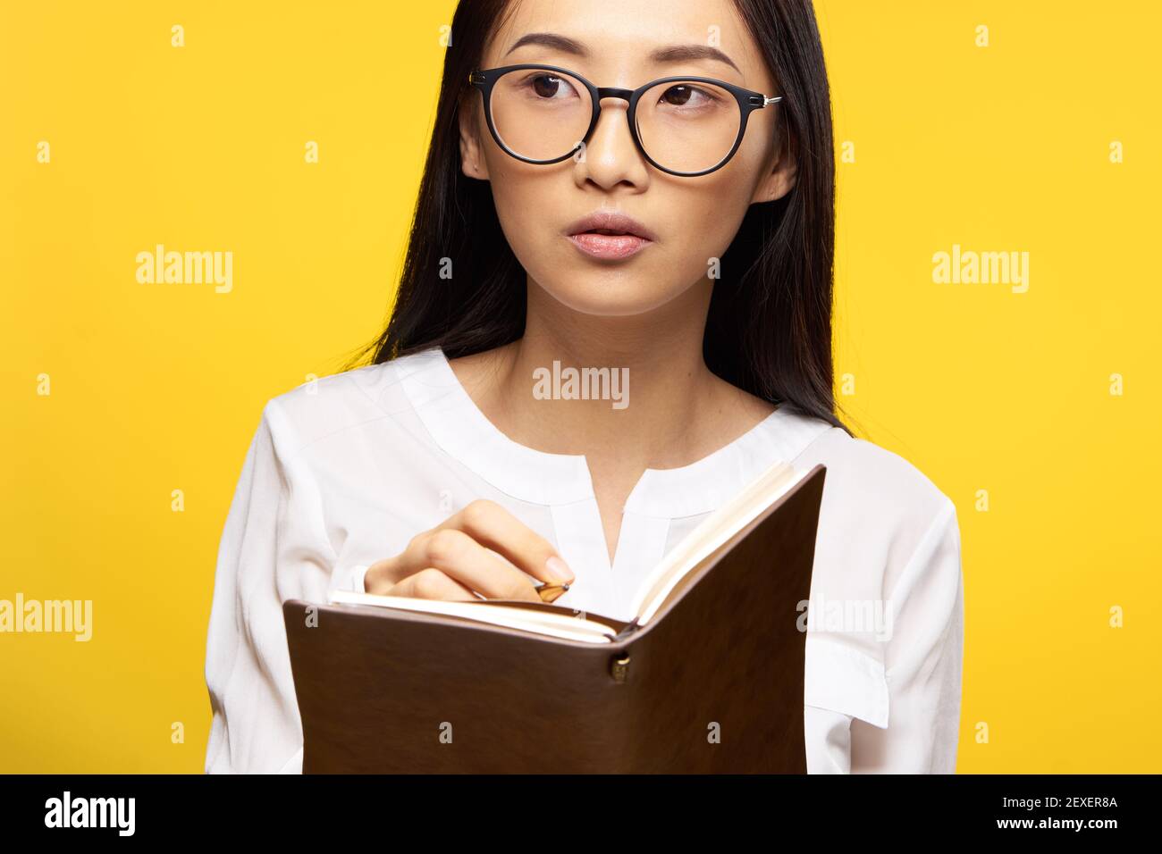 Business woman with notepad in hands elegant style manager yellow ...