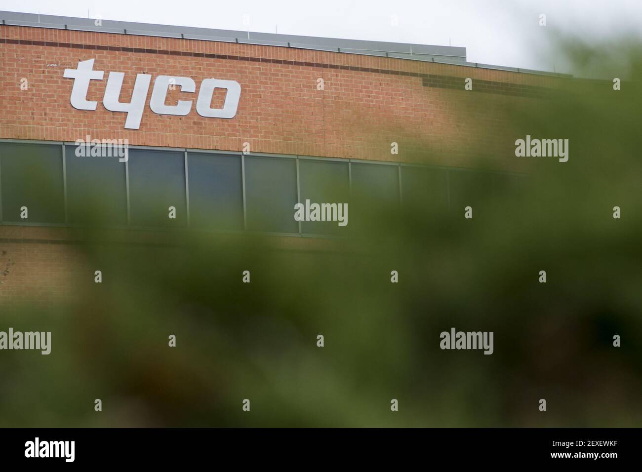 A logo sign outside of the headquarters of Tyco International Ltd., in ...