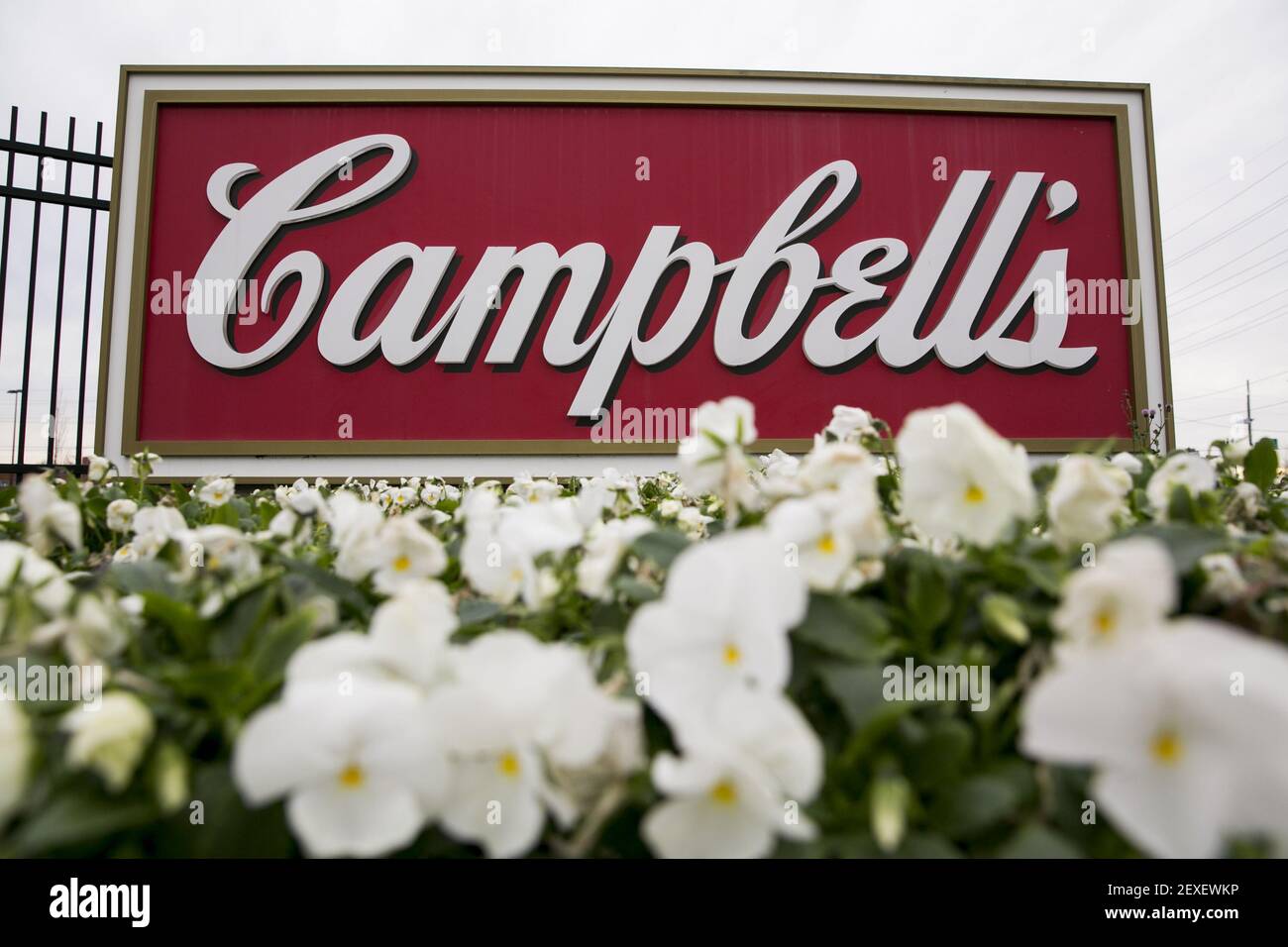 A logo sign outside of the headquarters of The Campbell Soup Company ...