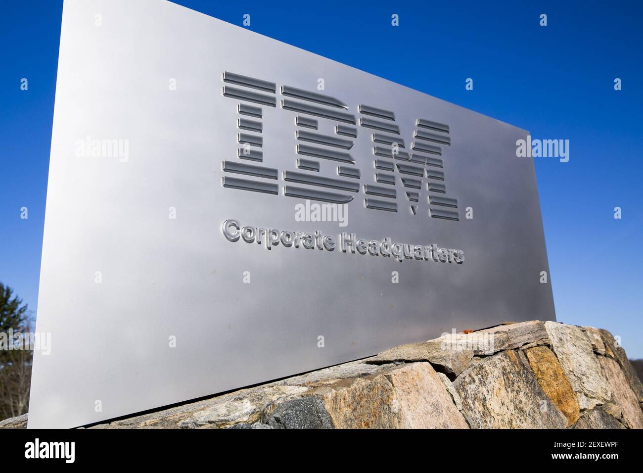 A logo sign outside of the headquarters of IBM in Armonk, New York on ...