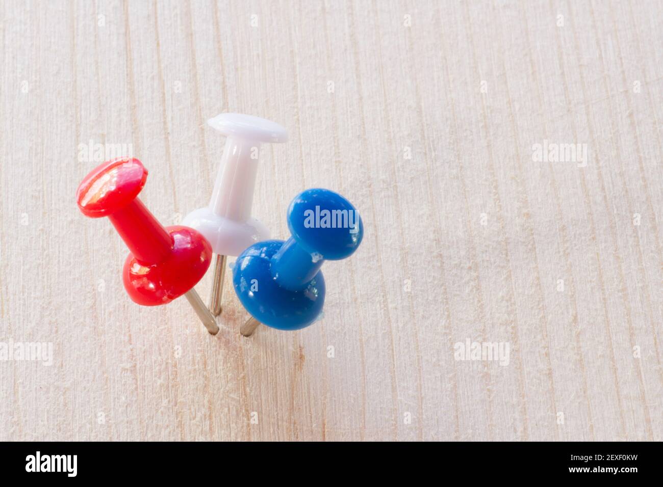 Three push pins Stock Photo - Alamy