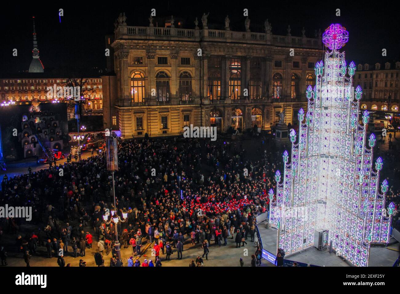 Christmas Tree and advent calendar in Piazza Castello. On background ...