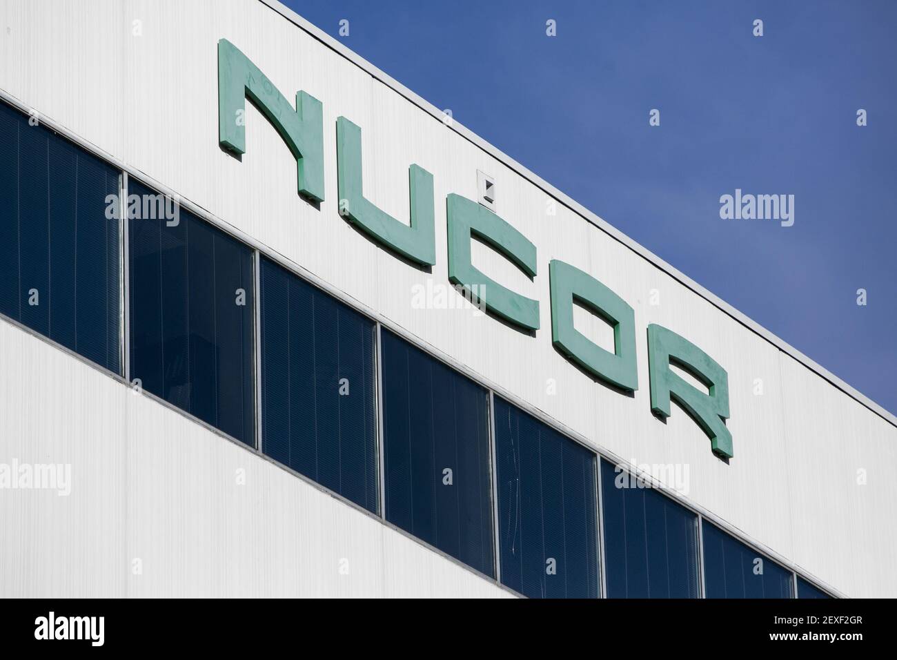 A logo sign outside of the headquarters of the Nucor Corporation in ...