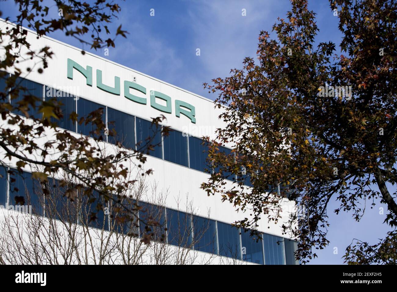 A logo sign outside of the headquarters of the Nucor Corporation in ...