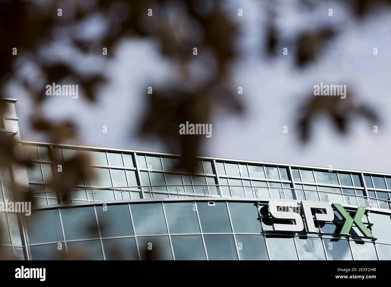 A logo sign outside of the headquarters of the SPX Corporation in ...