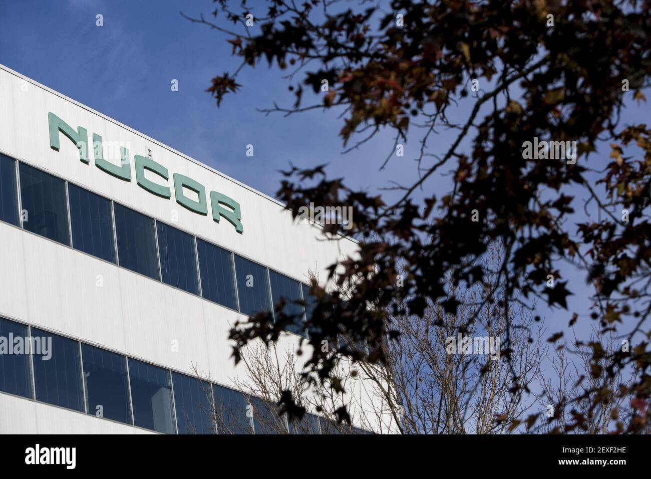 A logo sign outside of the headquarters of the Nucor Corporation in ...