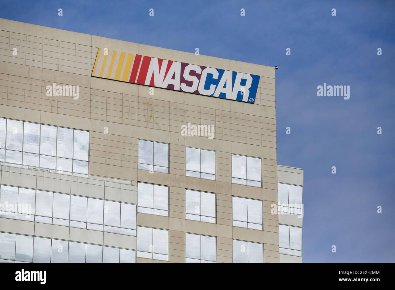 A logo sign outside of a facility occupied by the National Association ...