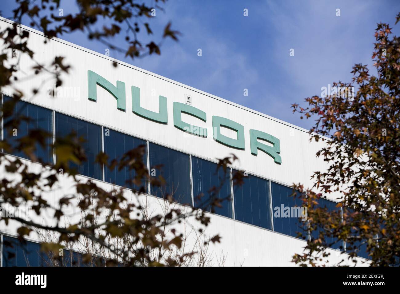 A logo sign outside of the headquarters of the Nucor Corporation in ...