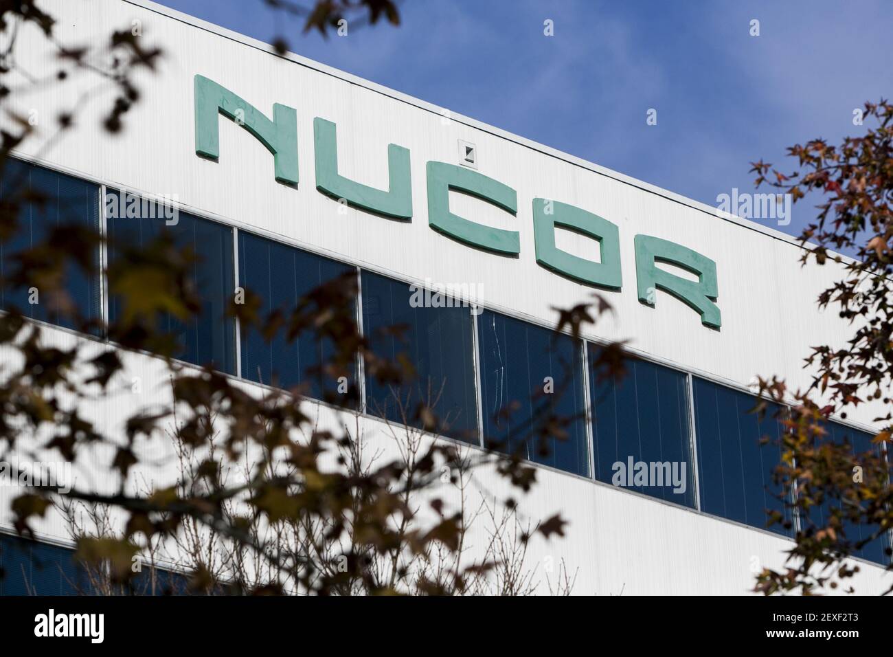 A logo sign outside of the headquarters of the Nucor Corporation in ...