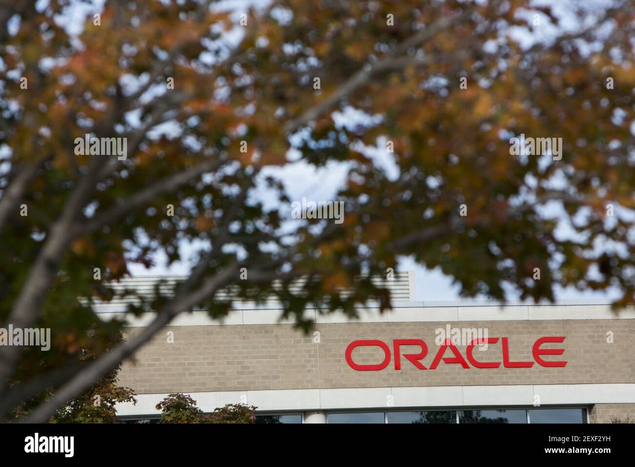 A logo sign outside of a facility occupied by The Oracle Corporation in ...