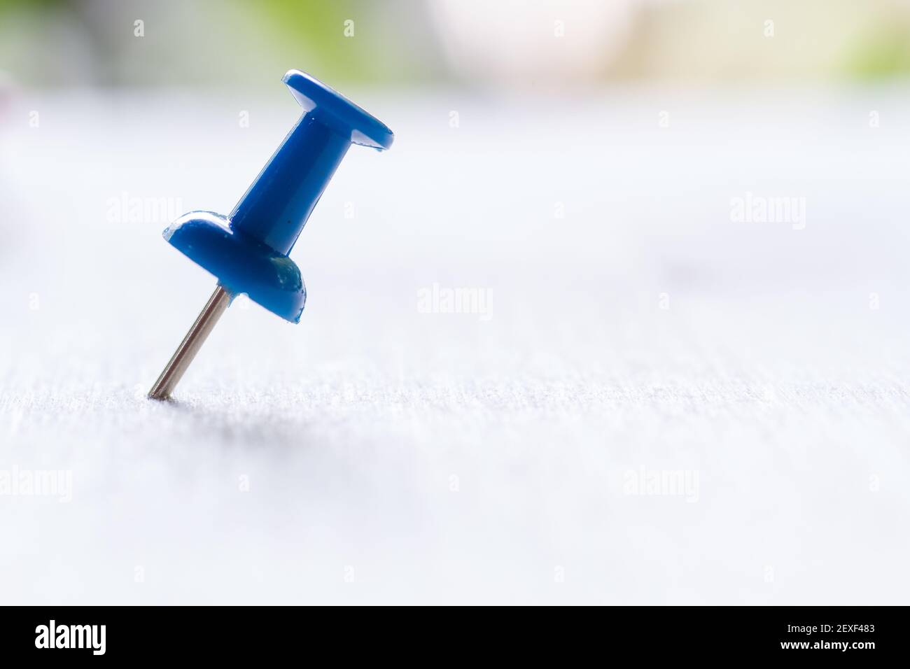 Blue push pin Stock Photo - Alamy