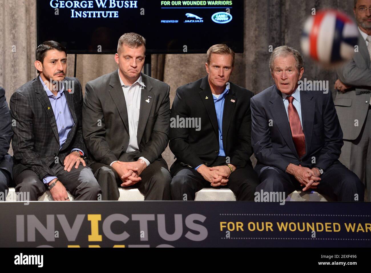 Former U.S. President George W. Bush (on right) sits next to (l-r ...