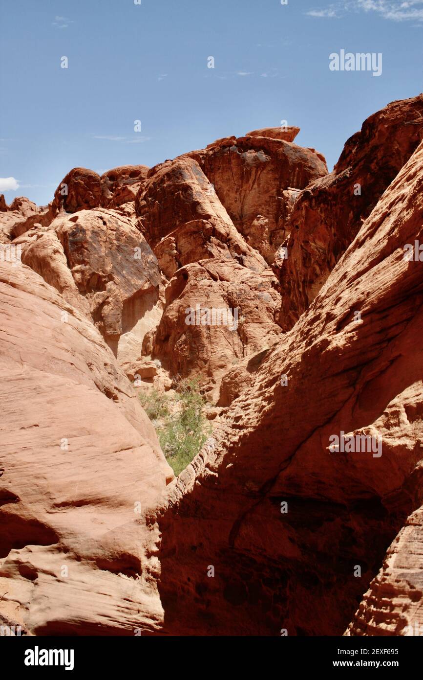 A vertical shot of red mountains under a blue sky Stock Photo - Alamy