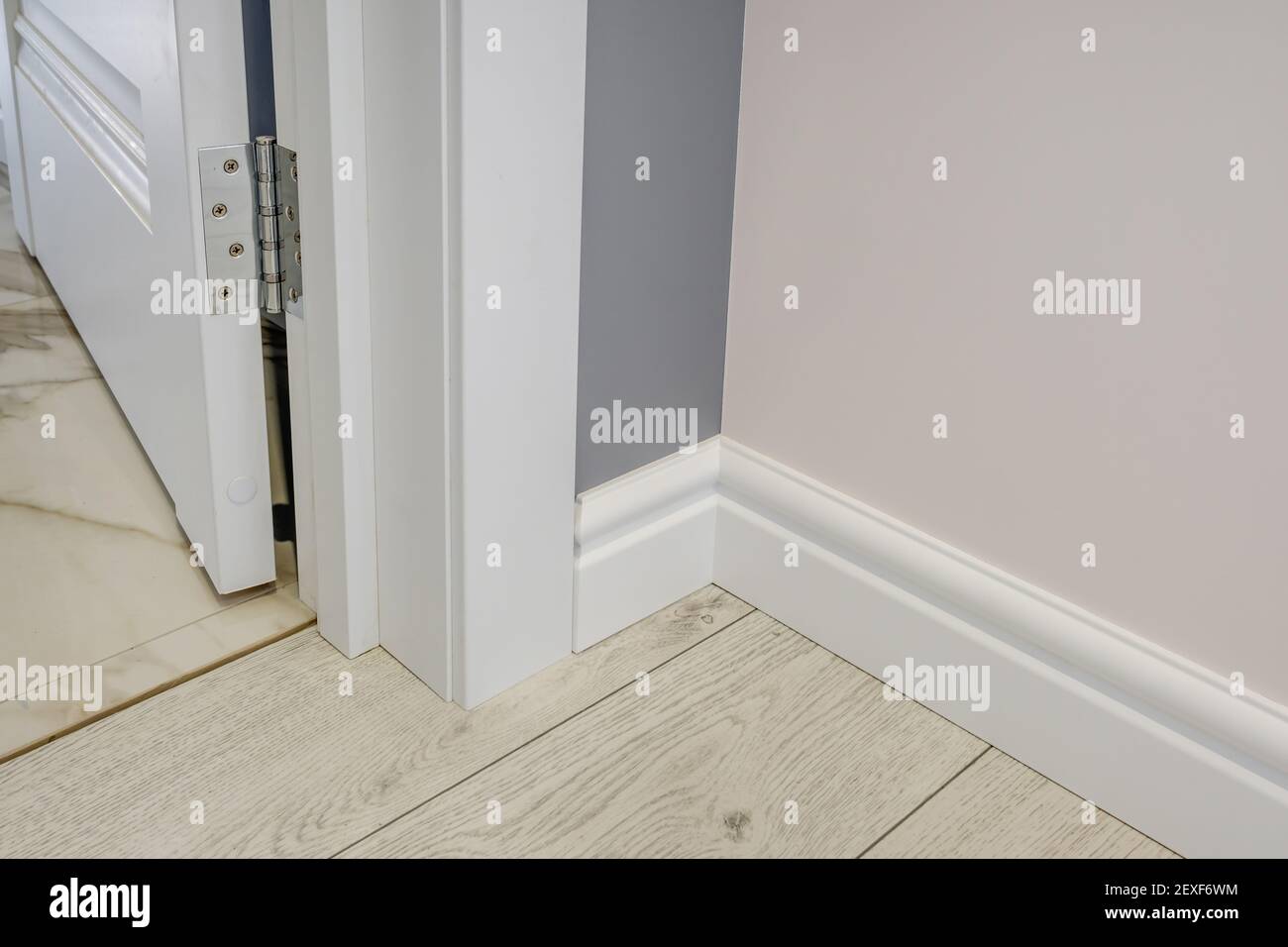 Detail of corner flooring with intricate crown molding and plinth Stock ...