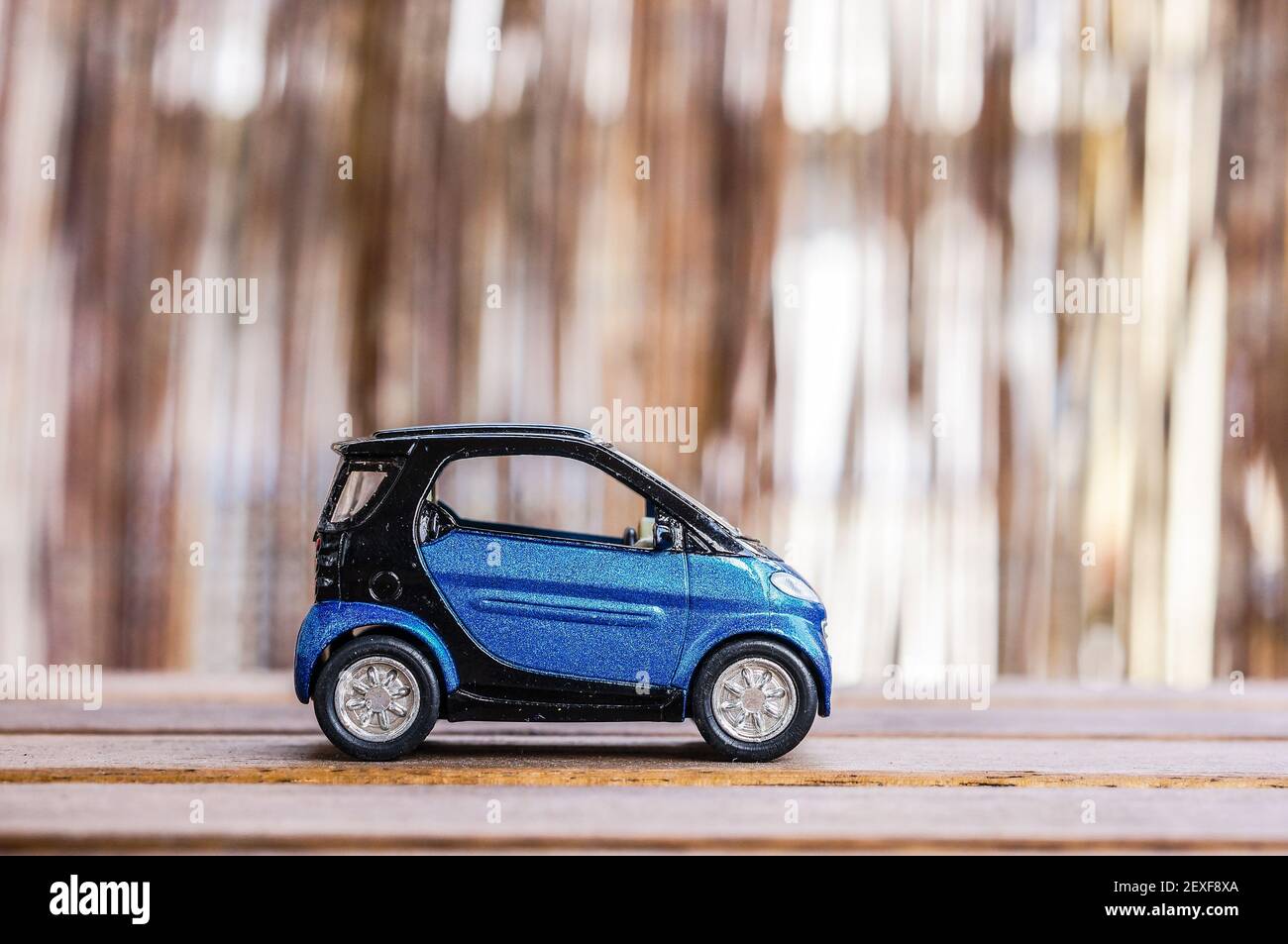 POZNAN, POLAND - Oct 26, 2016: Small blue toy model Smart car on a ...