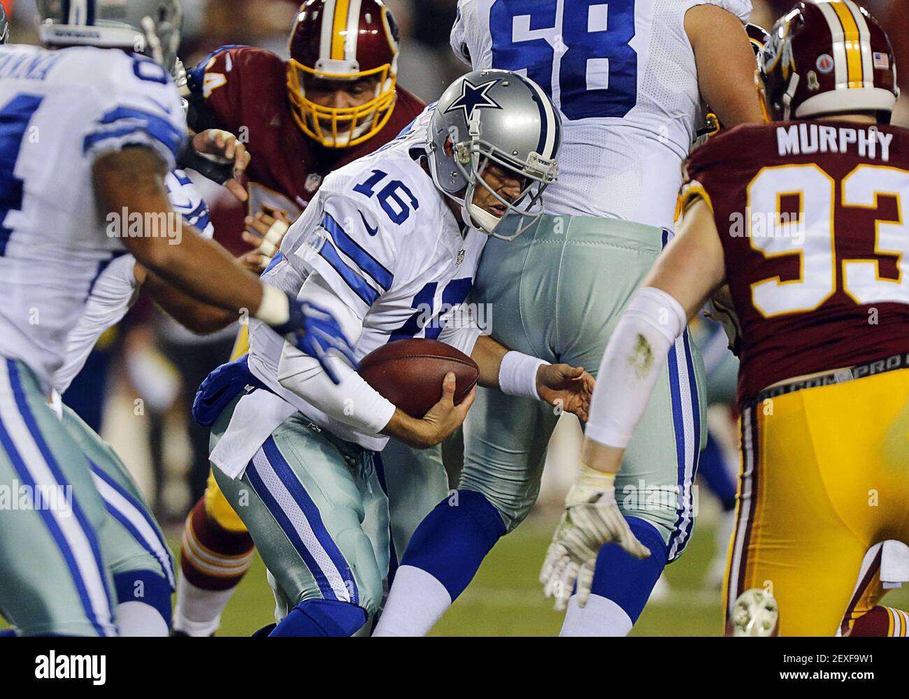 Dallas Cowboys quarterback Matt Cassel (16) runs into Dallas Cowboys ...
