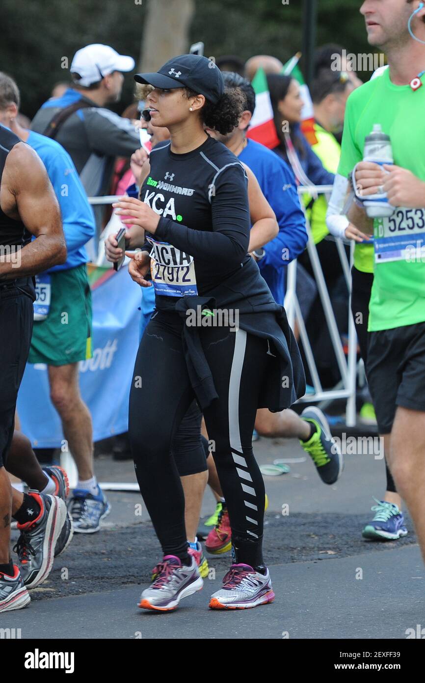 Singer Alicia Keys (black hat) runs in the TCS New York City Marathon ...