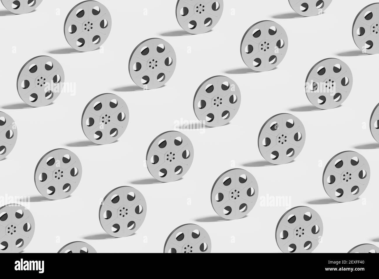 Multiple film rolls organized in a row over white background - 3D ...