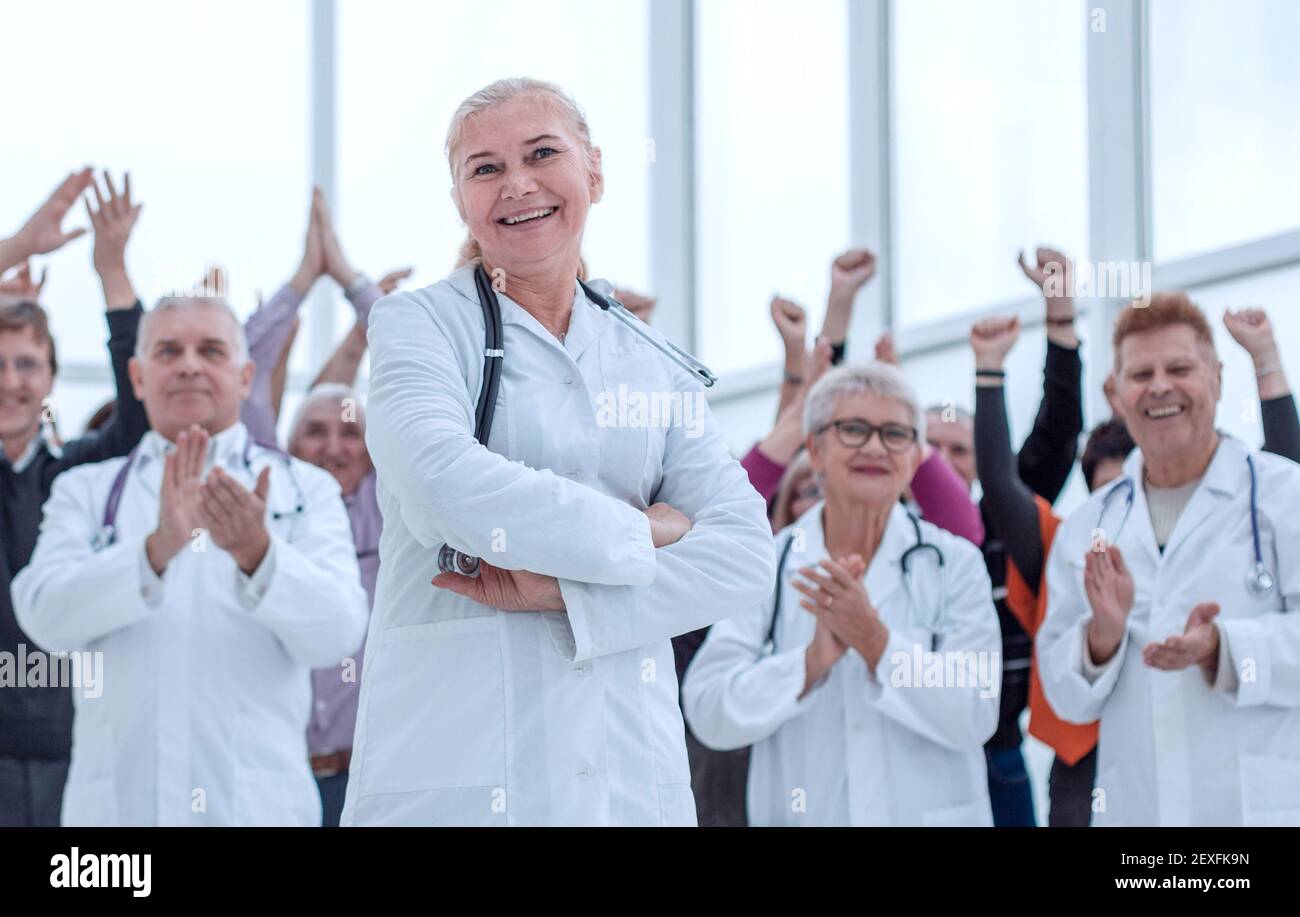 a group of doctors and recovered patients celebrate the victory Stock ...