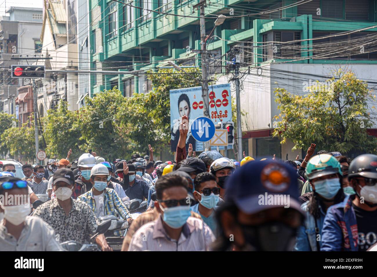 People are seen following the hearse carrying the coffin of Ma Kyal Sin ...
