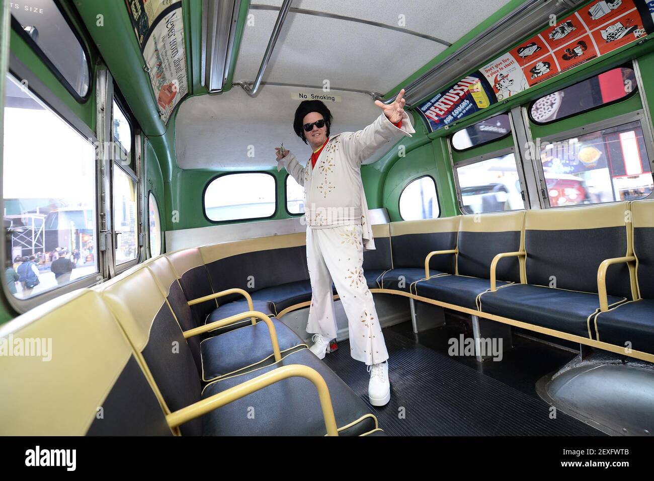 Elvis Presley impersonator Stephen Clark, takes a break from busking in ...