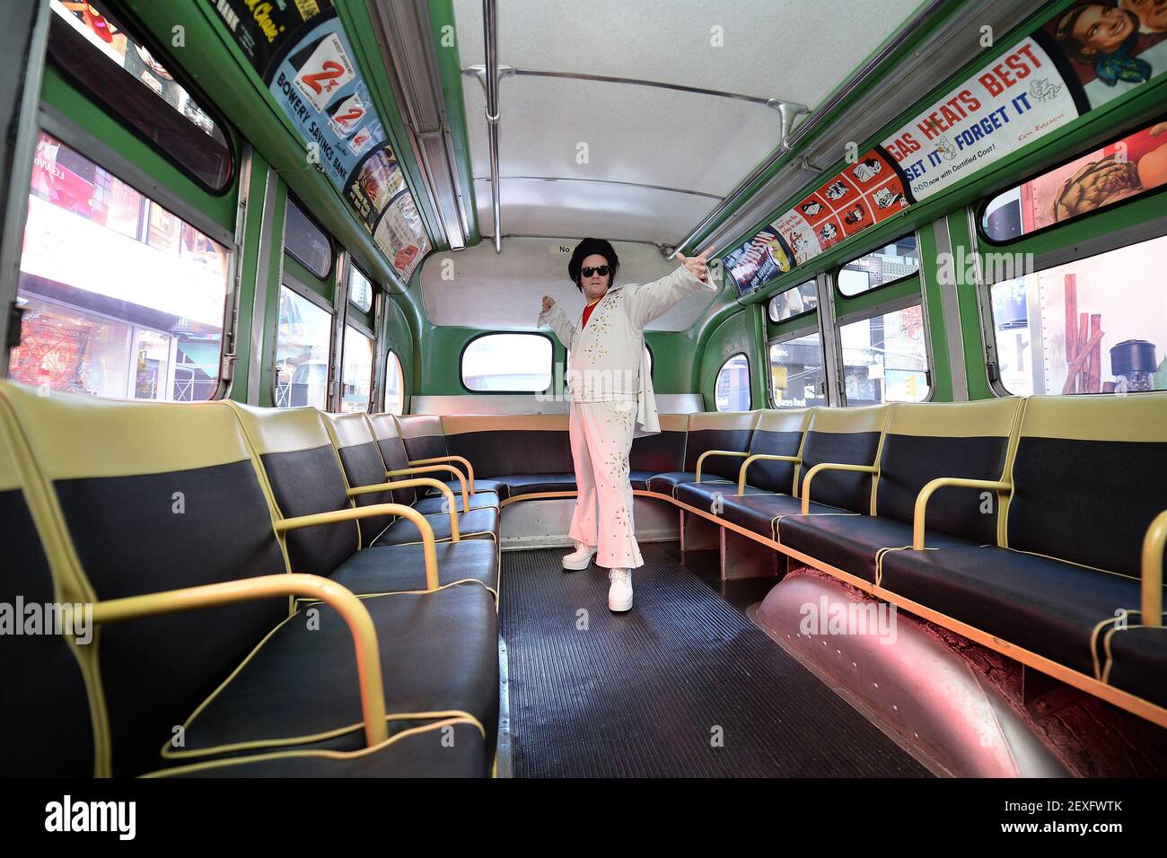 Elvis Presley impersonator Stephen Clark, takes a break from busking in ...