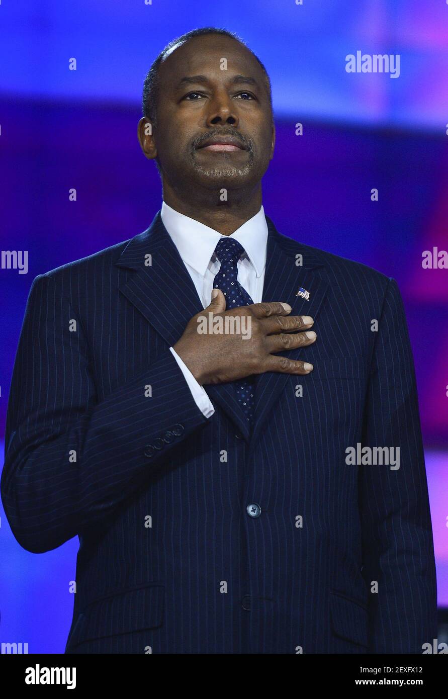 Presidential candidate Dr. Ben Carson stands for the national anthem ...