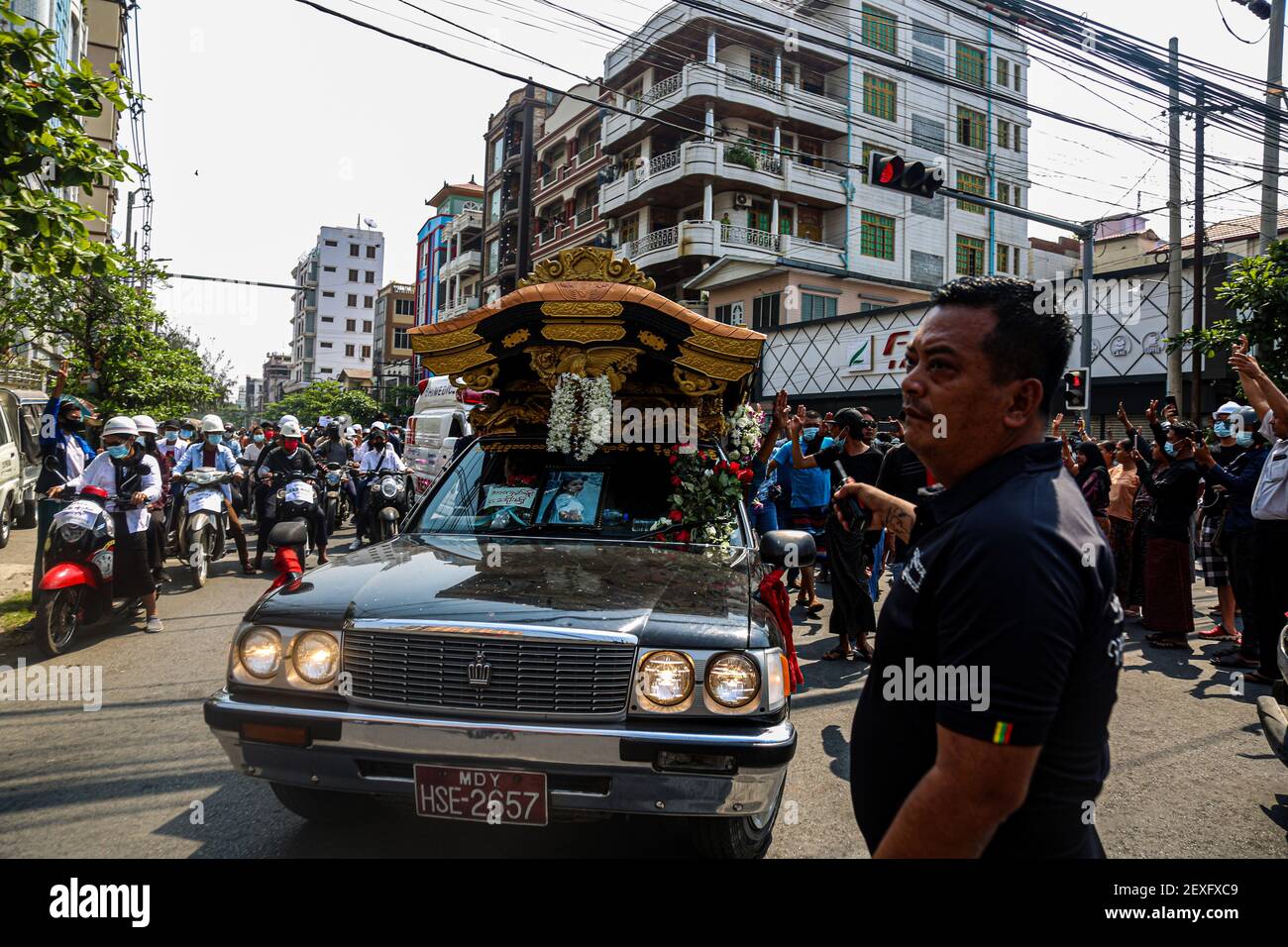 Mandalay, Myanmar. 04th Mar, 2021. People pay respect as the hearse ...