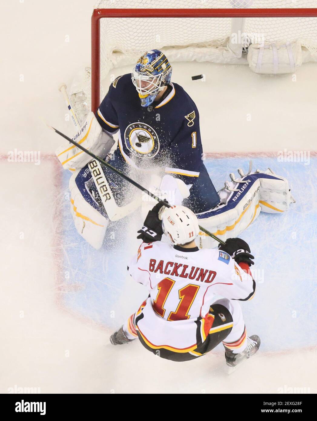 St. Louis Blues goaltender Brian Elliott is unable to stop a goal by ...