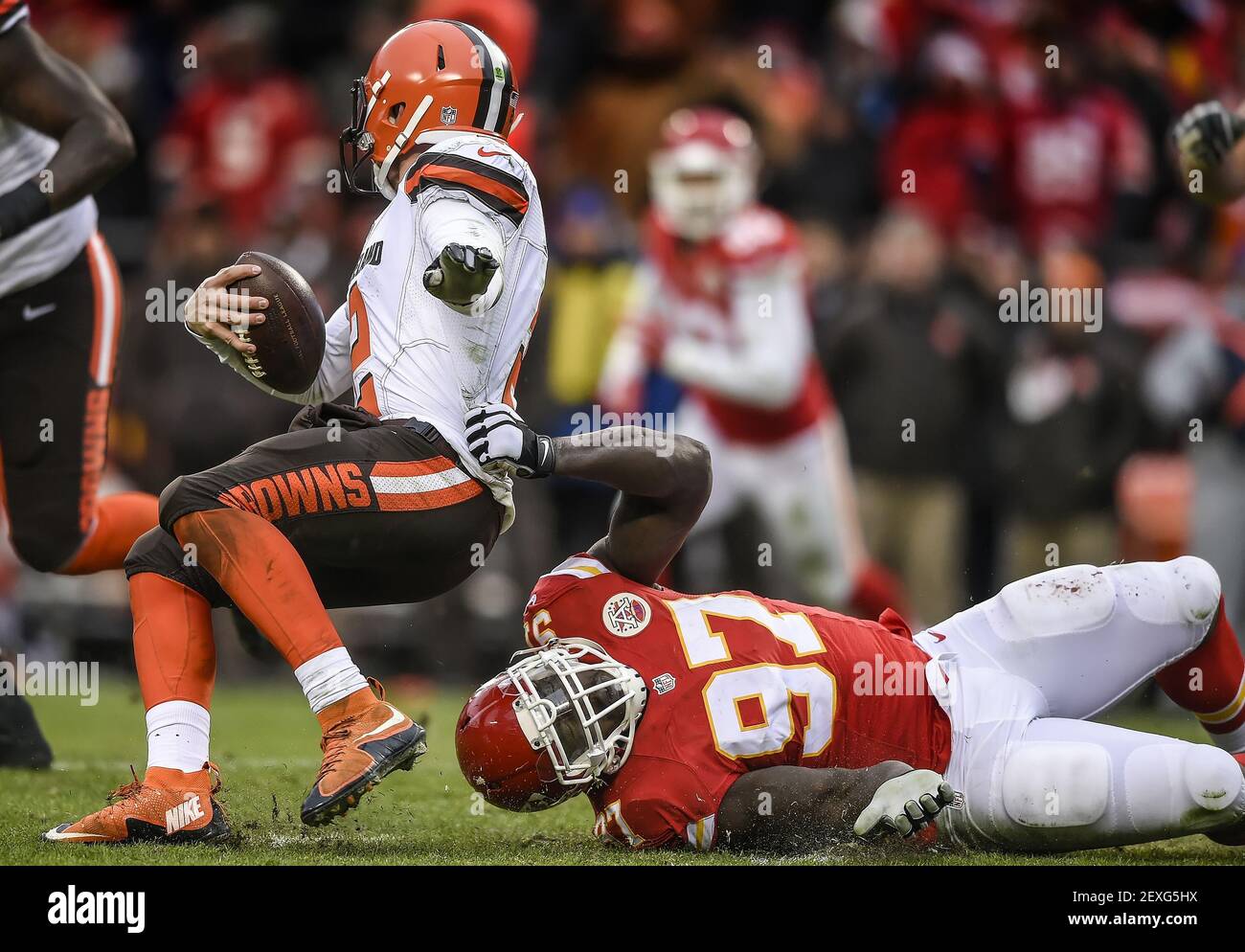 Kansas City Chiefs defensive end Allen Bailey (97) is able to hang on ...