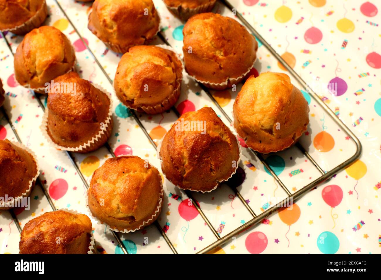 A closeup shot of homemade delicious muffins on an oven rack Stock ...