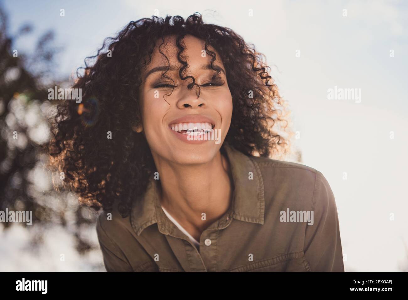 Photo of attractive positive wavy hairdo dark skin person toothy smile ...