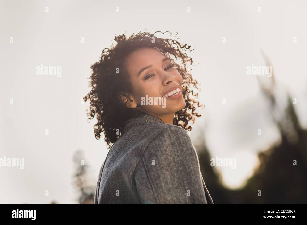 Profile portrait of adorable cheerful curly hairstyle dark skin young ...