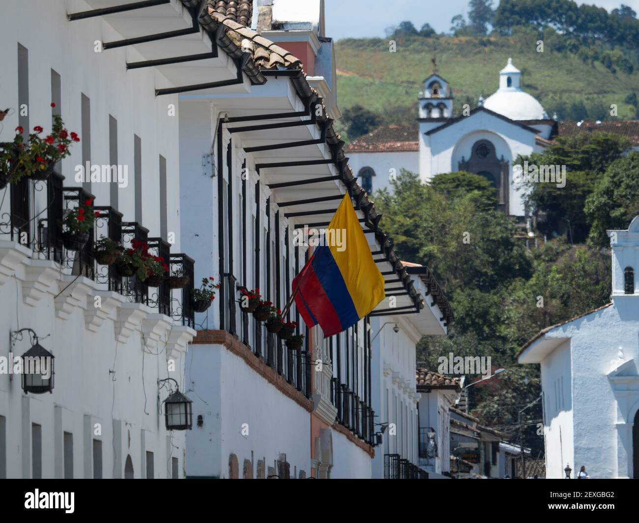 Colombian national flag on white walls exterior facade colonial ...