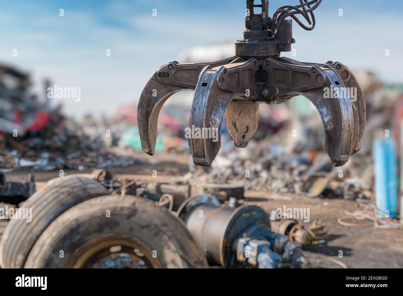 Mechanical arm claw of crane at landfill grabbing waste Stock Photo - Alamy