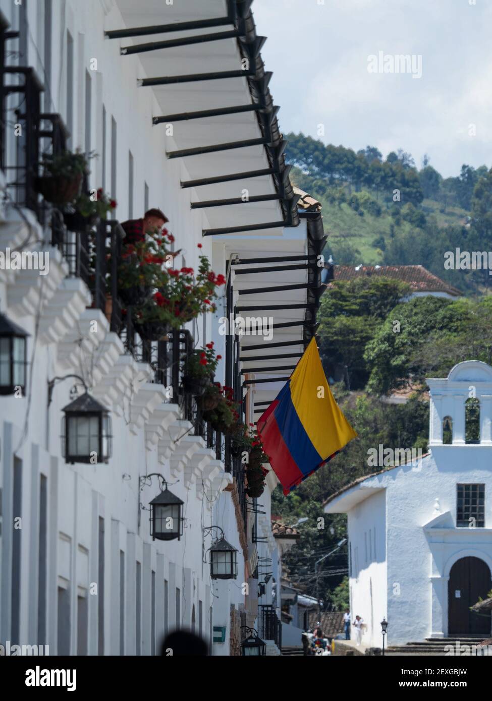 Colombian national flag on white walls exterior facade colonial ...